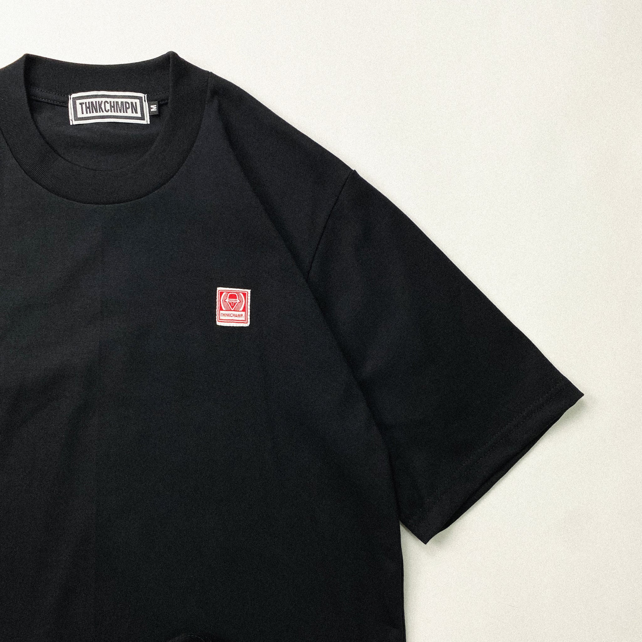 ICONIC PATCH | OVERSIZED TEE IN BASALT BLACK – THNKCHMPN